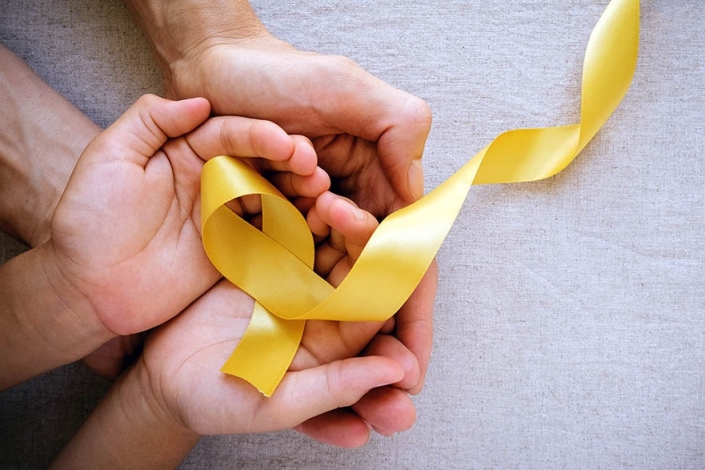 Lazo amarillo cáncer infantil · Scouts de España